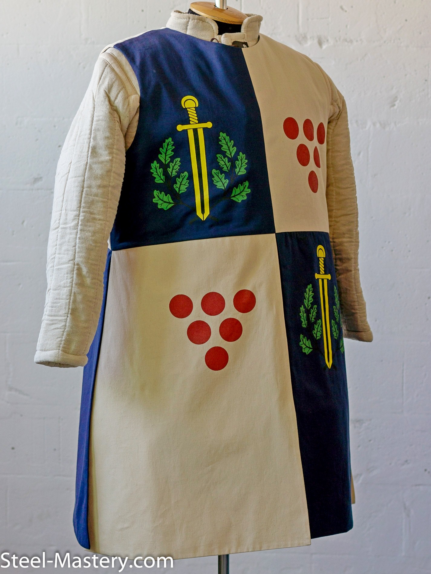 Tabard with silk-screening of scarlet dots, golden swords, and green ...